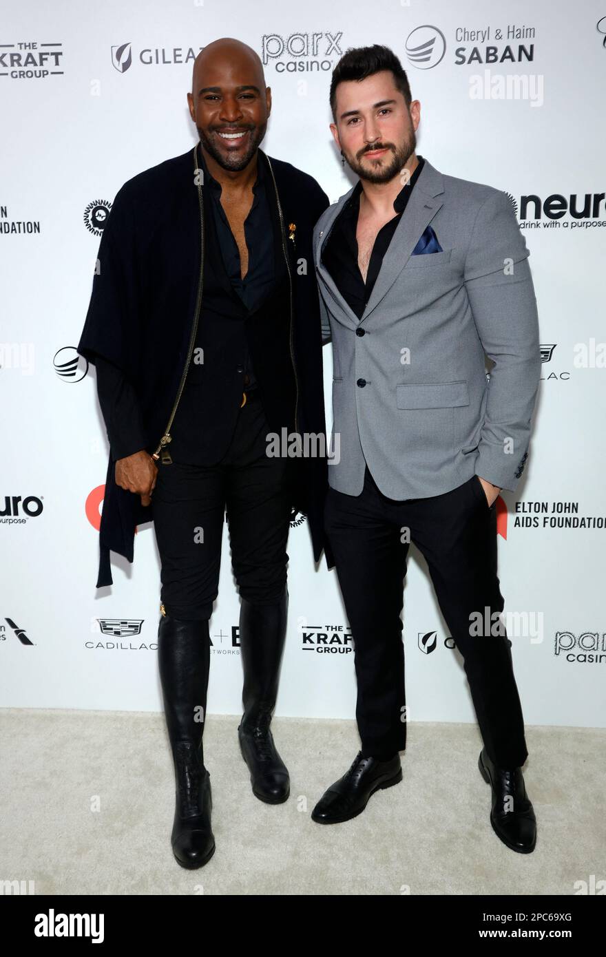 Karamo Brown and Carlos Medel attend the Elton John AIDS Foundation's ...