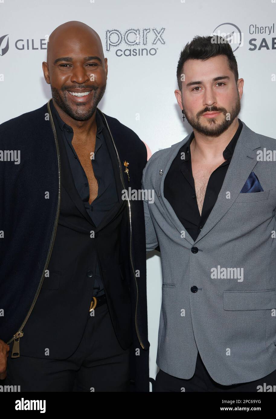 Karamo Brown and Carlos Medel attend the Elton John AIDS Foundation's ...