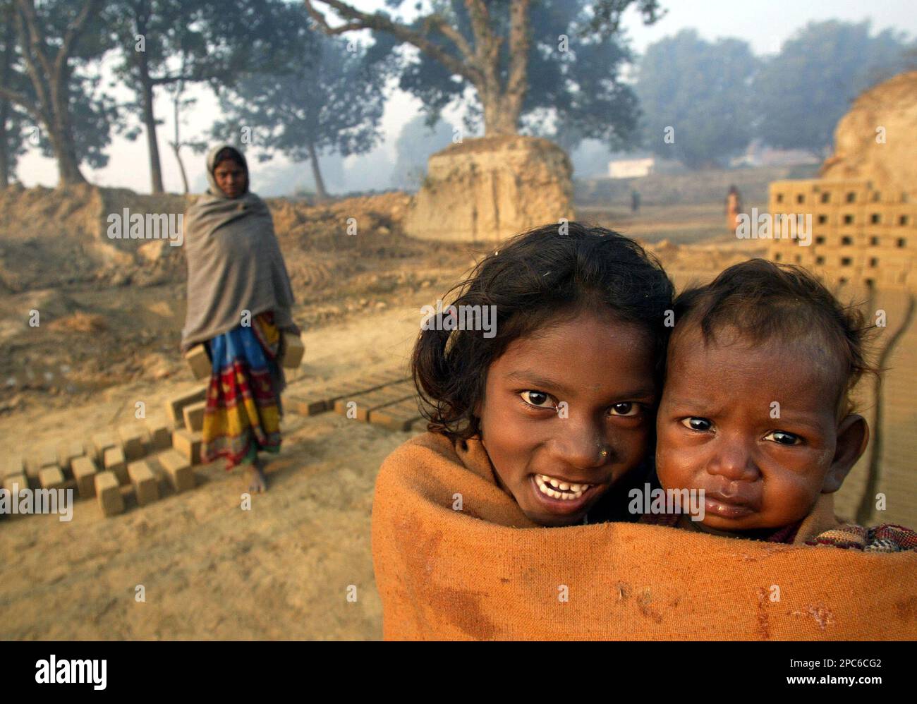 Children of a brick factory workers play on the outskirts of Allahabad ...