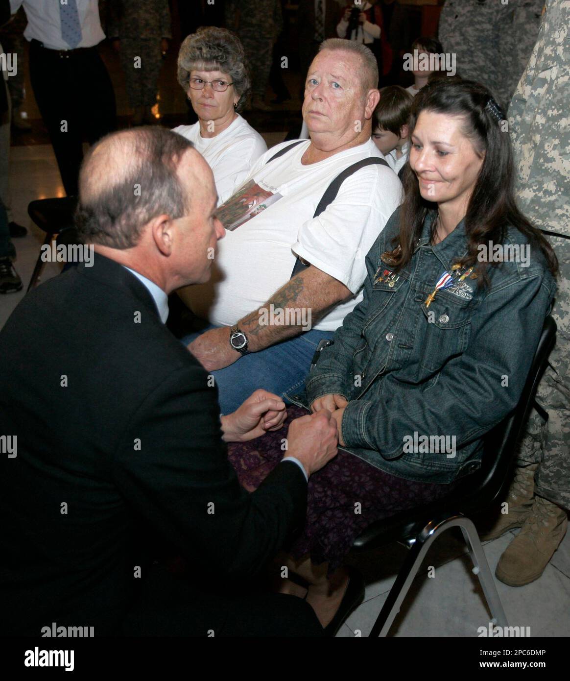 Indiana Gov. Mitch Daniels, left, comforts Beth Proctor after he ...