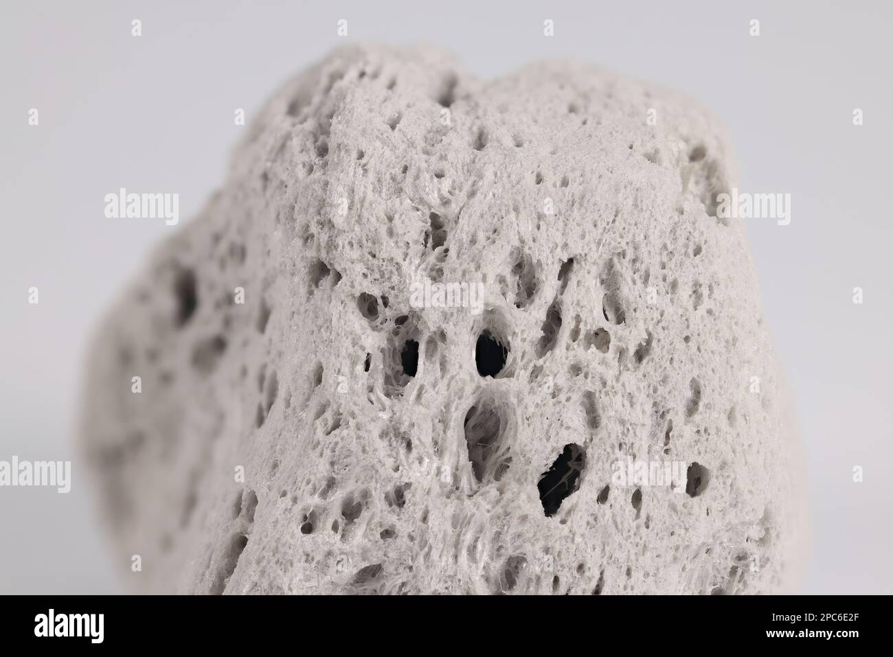 Pumice is a volcanic rock that consists of highly vesicular rough ...