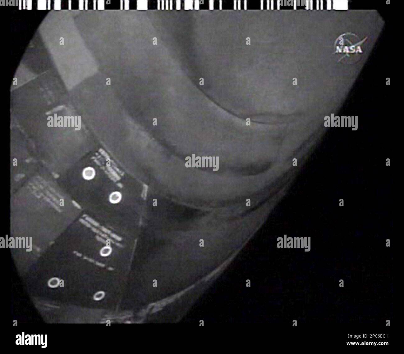 In this image from NASA Television a camera mounted on Space Shuttle ...