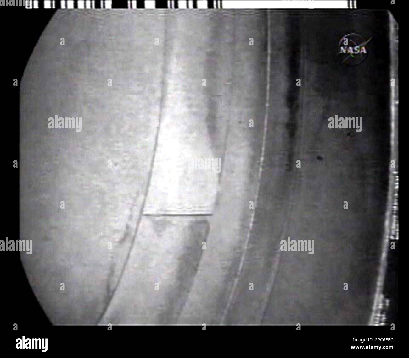 In this image from NASA Television a camera mounted on Space Shuttle ...
