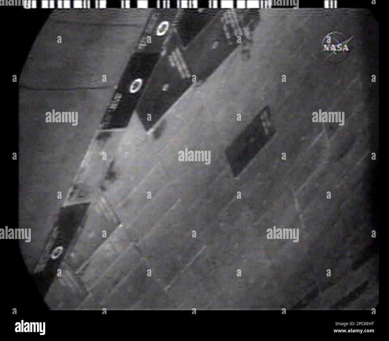 In this image from NASA Television a camera mounted on Space Shuttle ...