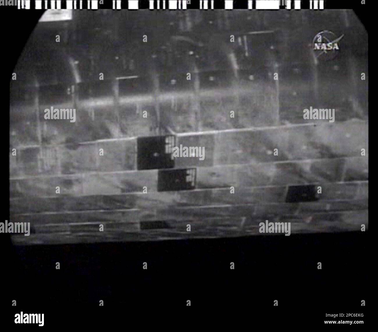 In this image from NASA Television, a camera mounted on Space Shuttle ...