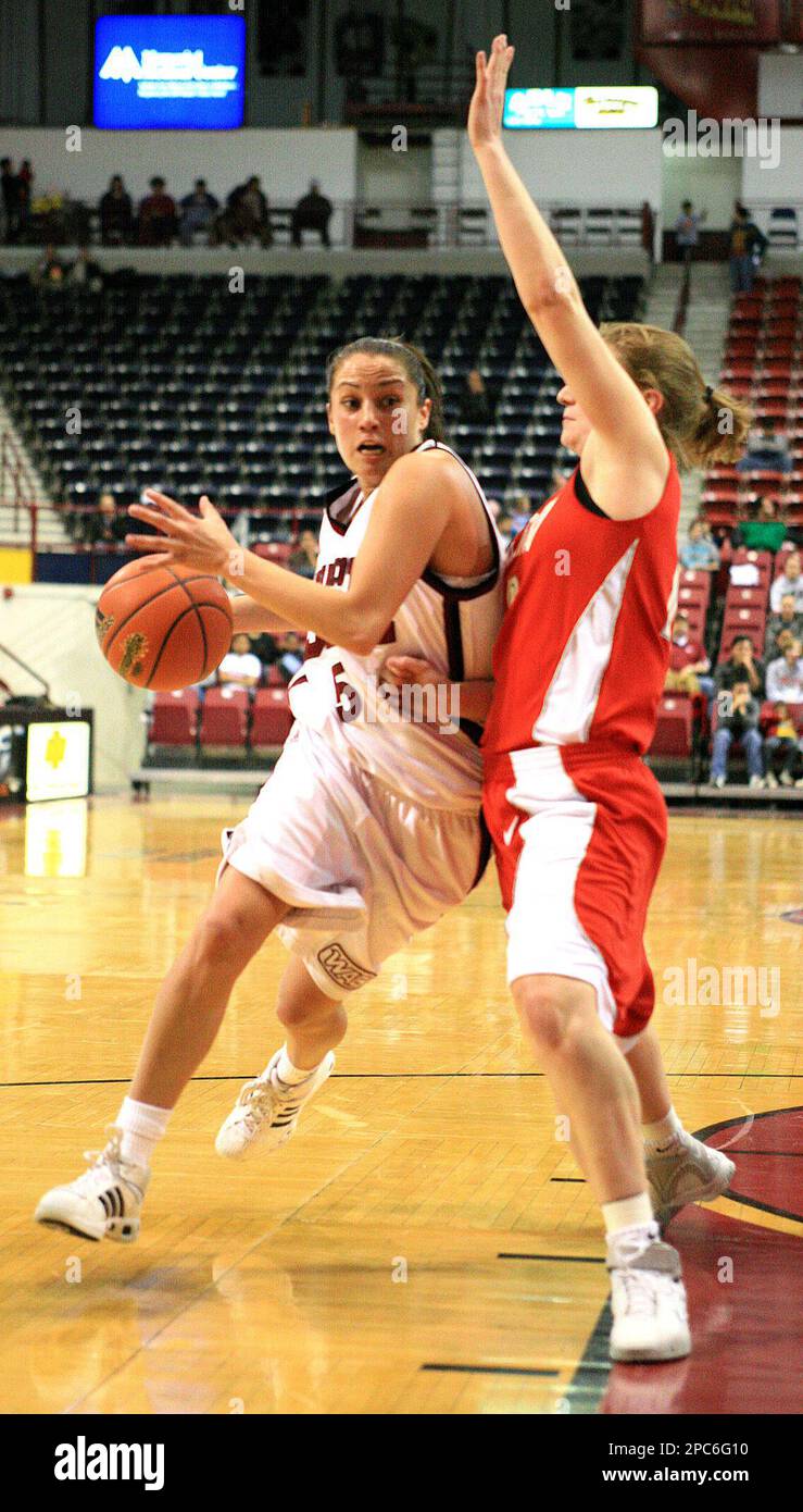 New Mexico State's Cecilia Russell-Nava attempts to drive past New ...