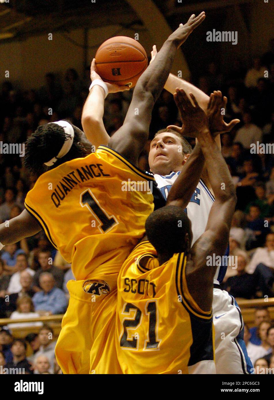 Duke's Josh McRoberts shoots through Kent's Haminn Quaintance (1) and ...
