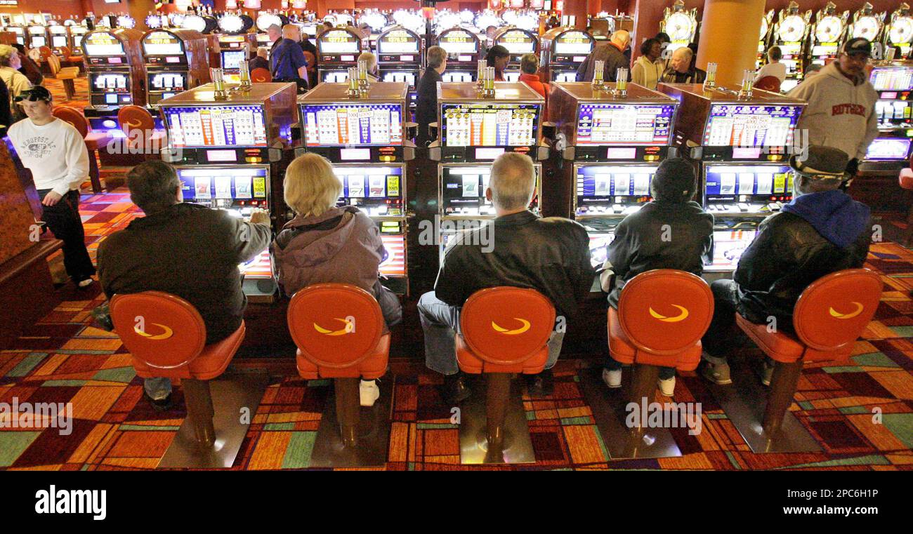 People are seen playing slot-machines at the Philadelphia Park Casino ...
