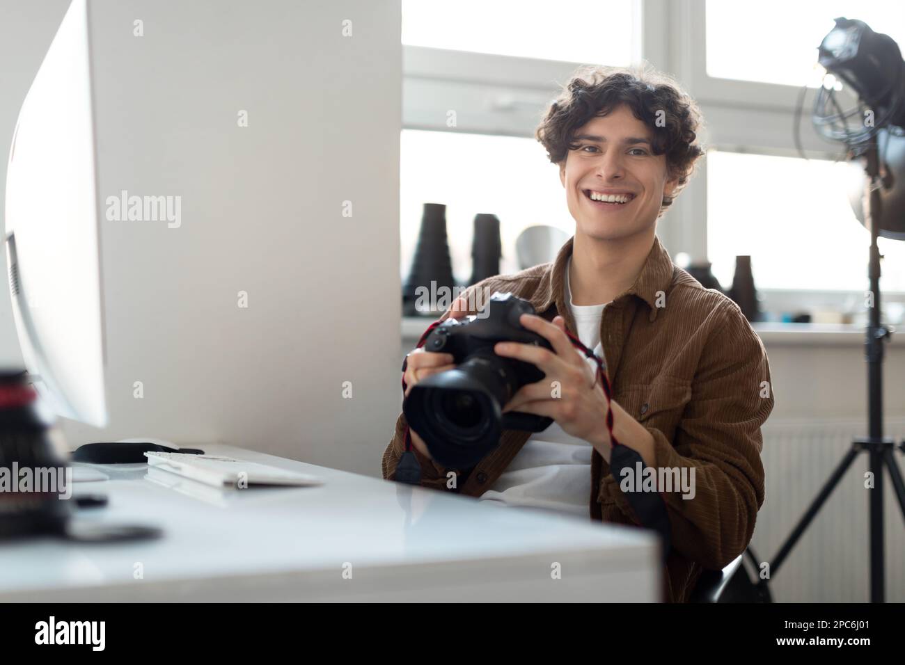 Looking at camera confidence smiling sitting photograph journalist hi ...