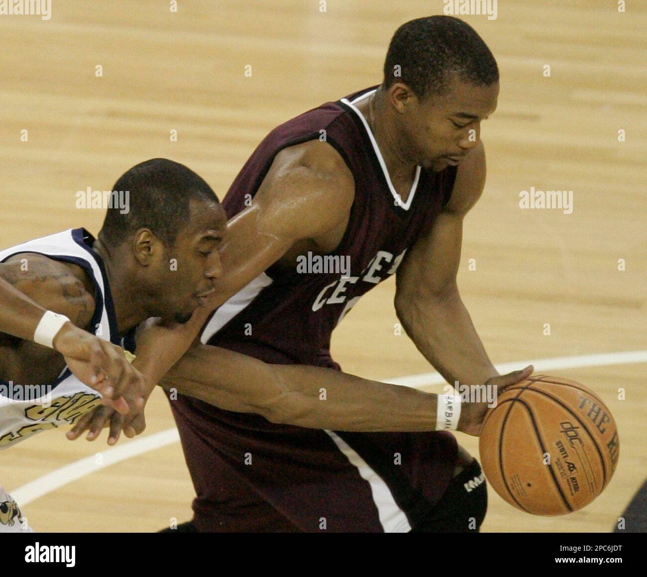 Georgia Tech's Mario West, left, tries to strip the ball from Centenary ...