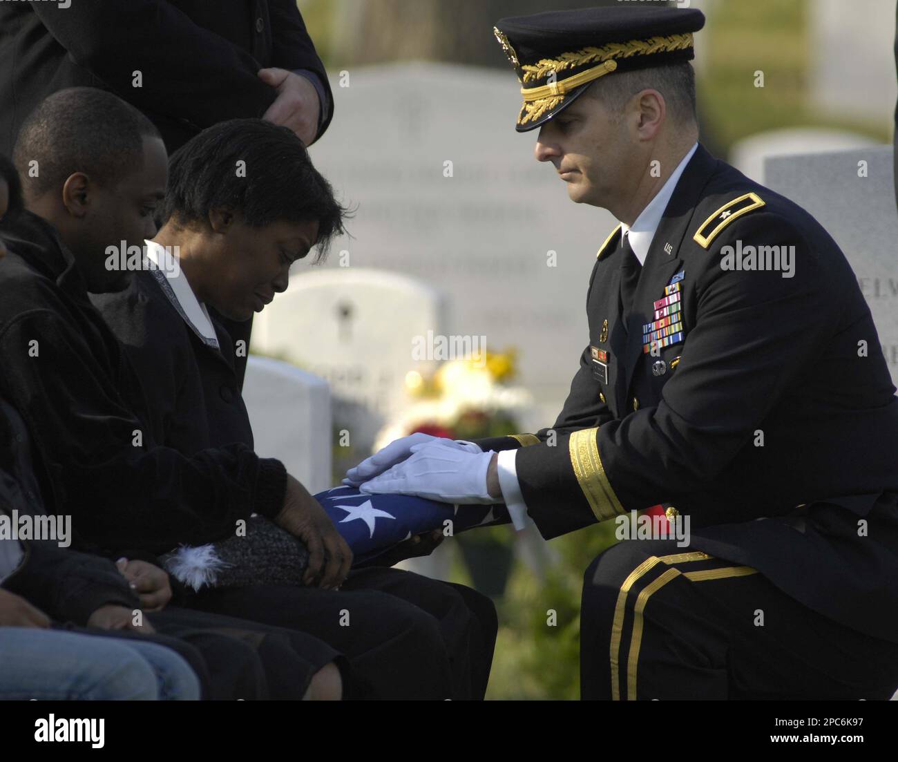 Brig. Gen. Anthony Cucolo, right, presents Jean Feggins the American ...