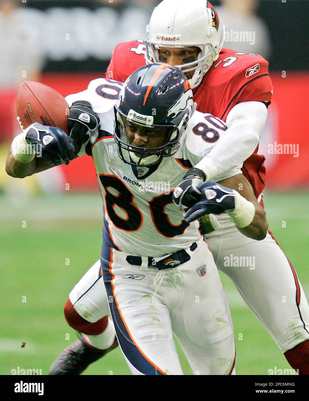 Denver Broncos' Rod Smith (80) has the ball stripped away by Arizona ...
