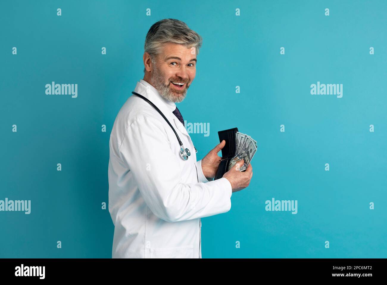 Doctor counting money in medical hi-res stock photography and images ...