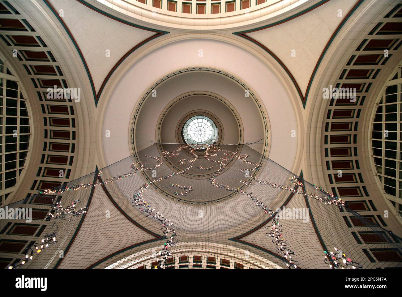 Holiday lights hang from the ceiling of the rotunda at Rowes Wharf in ...