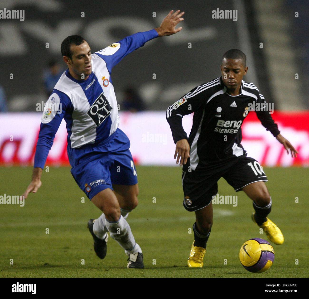Real Madrid player Robinho, right, duels for the ball against Espanyol ...