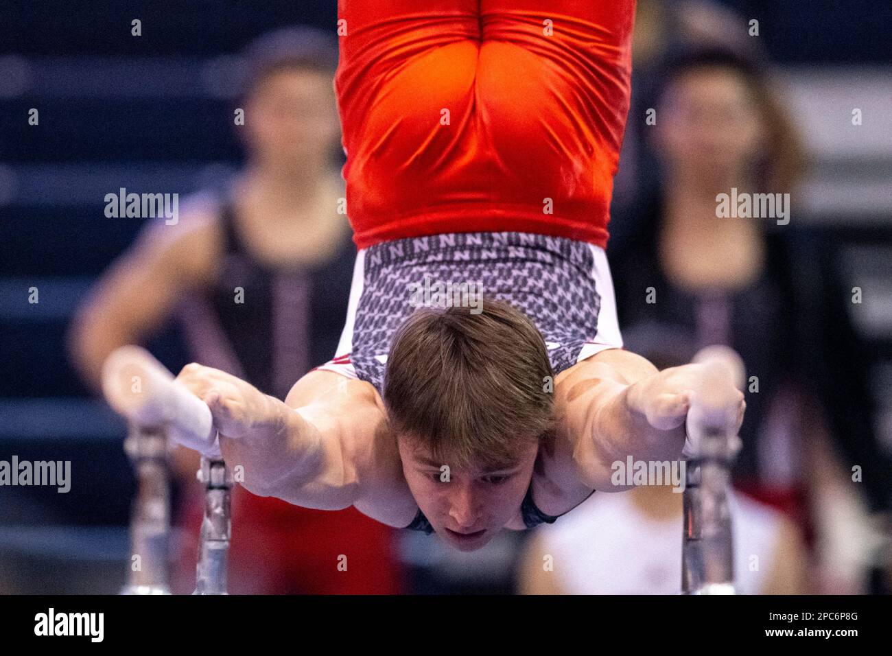 Nebraska gymnast Asher Cohen competes on the parallel bars of an NCAA ...