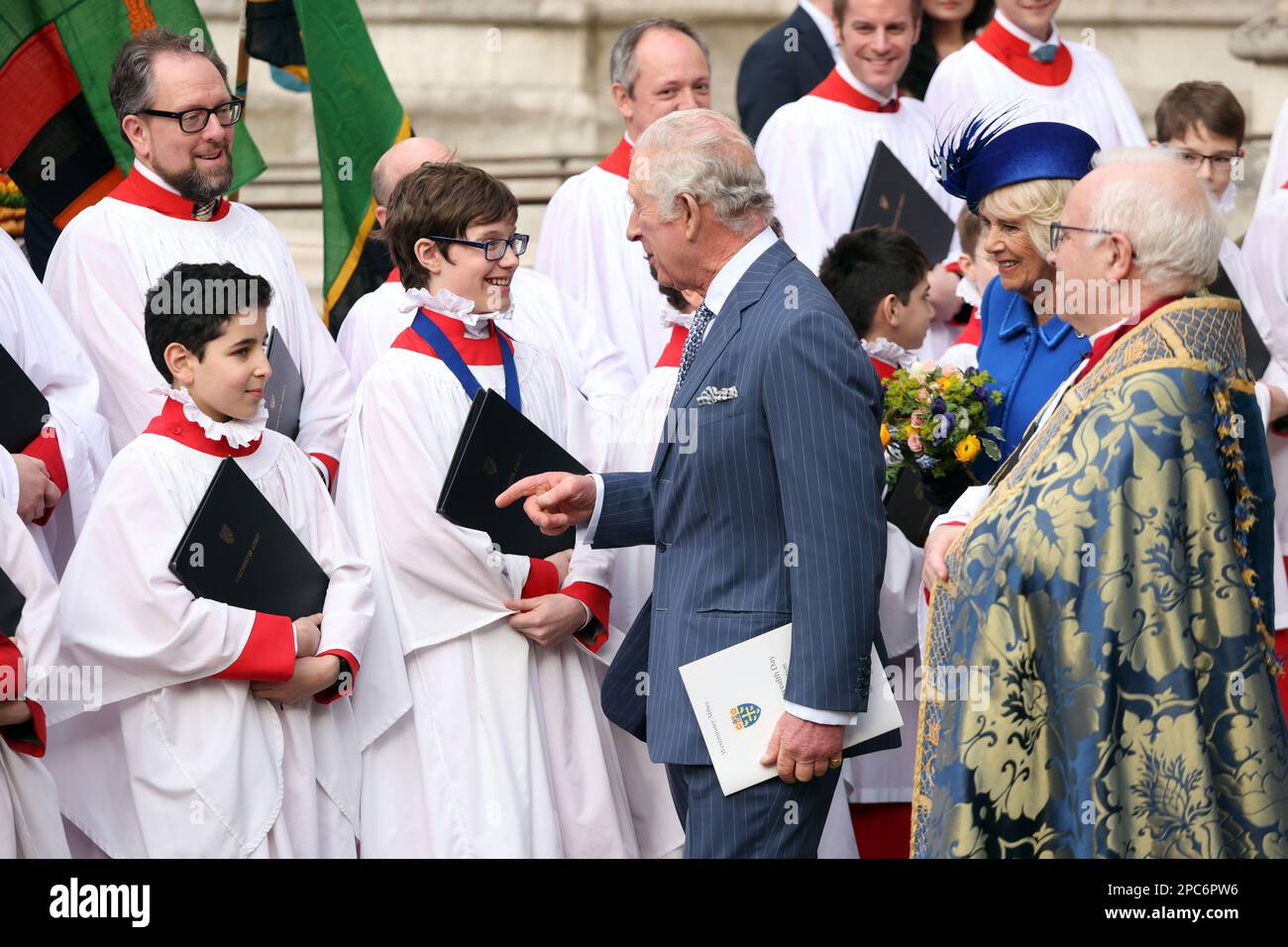 King Charles III and the Queen Consort speak to choristers as they ...