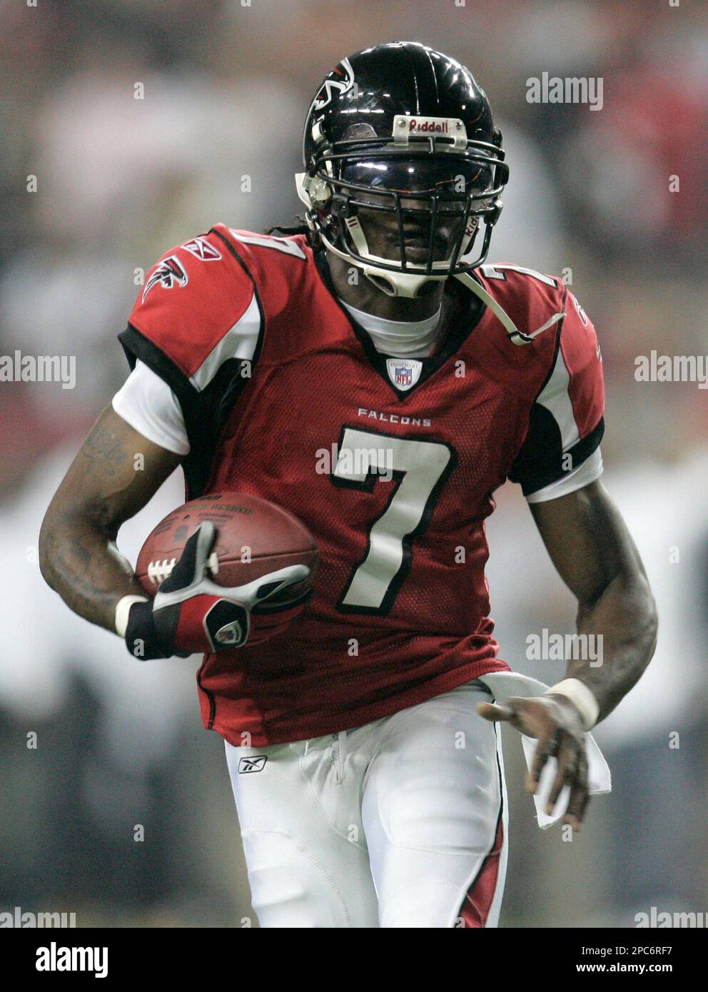 Atlanta Falcons' Michael Vick scrambles for yardage against the Dallas ...