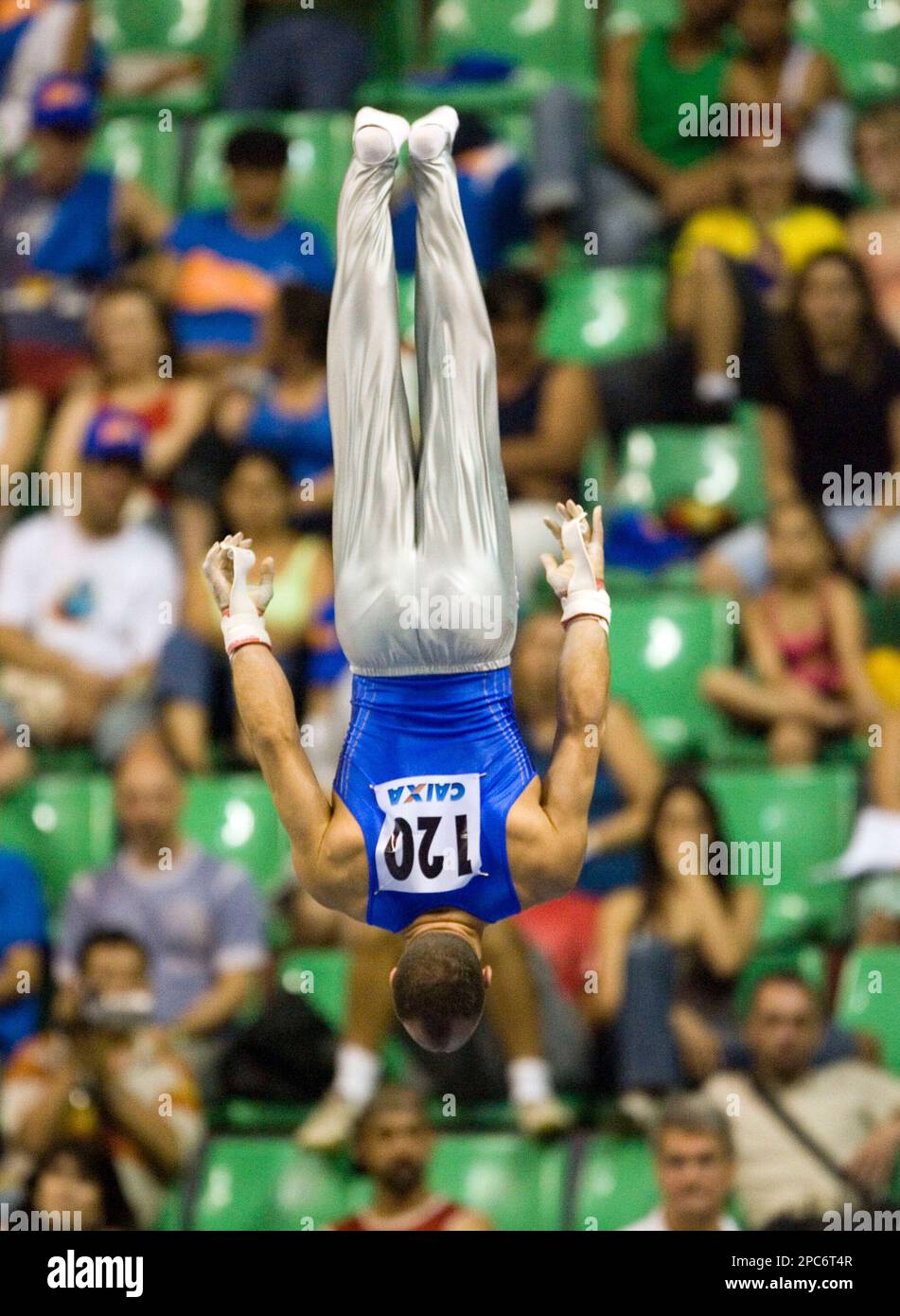 Italy's Andrea Coppolino competes on the Rings during the Artistic ...