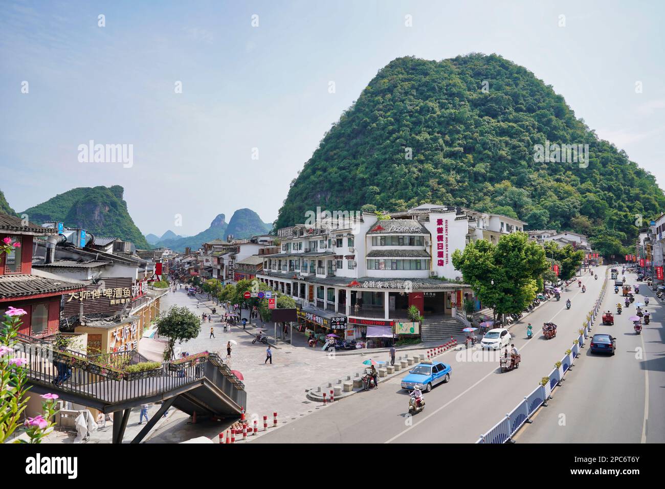 A wide highway in Yangshuo surrounded by lofty mountains Stock Photo ...