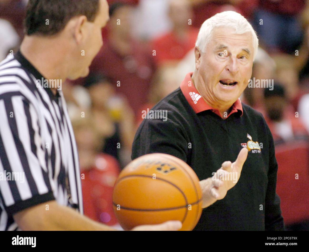 Texas Tech basketball coach Bob Knight, right, talks with an official ...