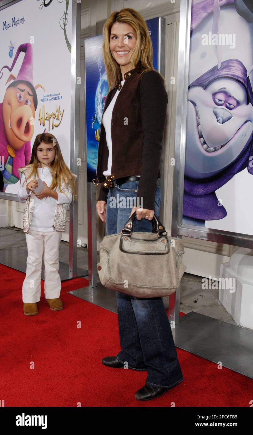 Actress Lori Loughlin poses as her daughter Olivia looks on at the ...