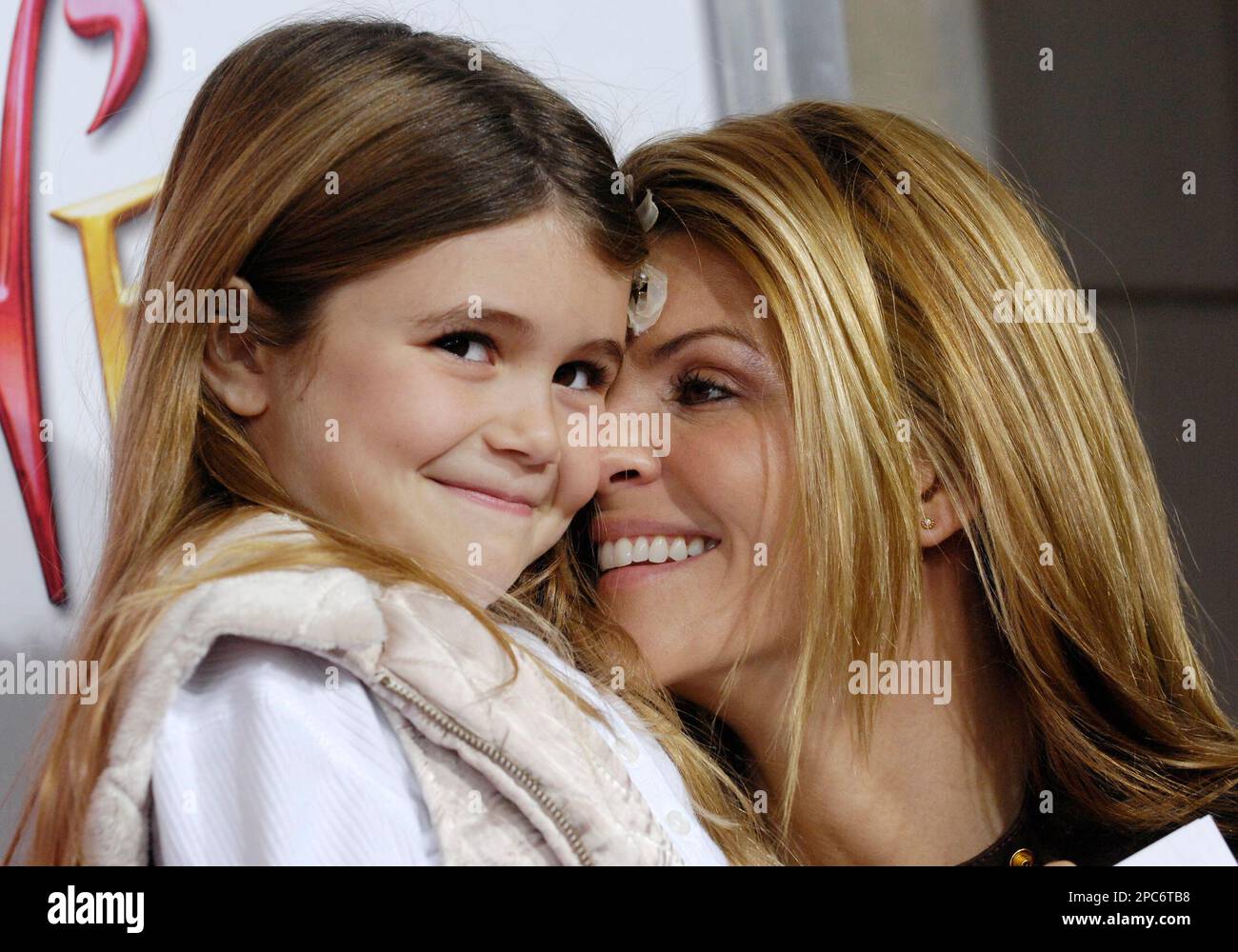 Actress Lori Loughlin poses with her daughter Olivia at the premiere of ...