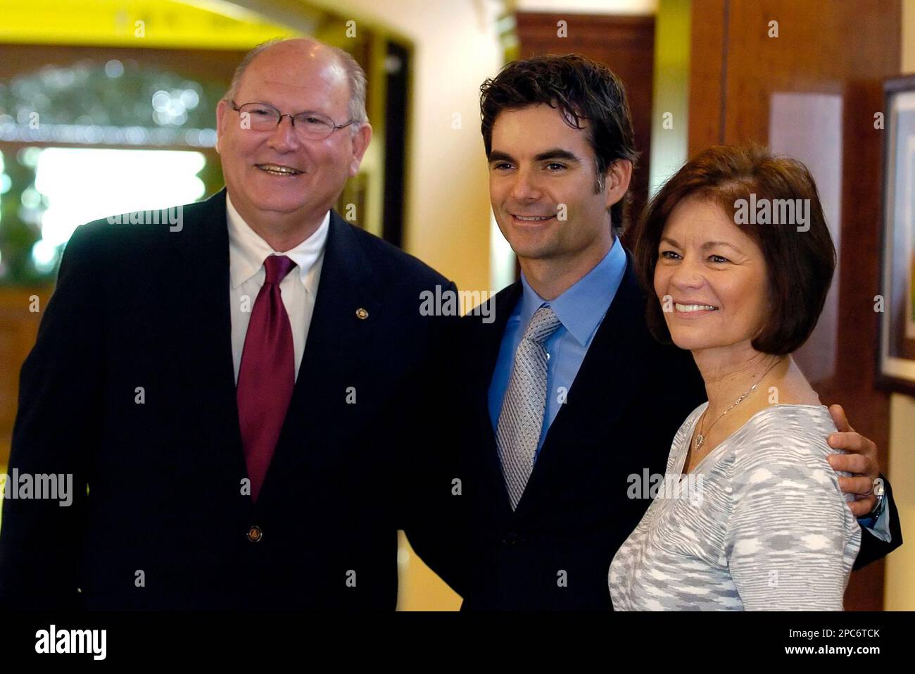 NASCAR driver Jeff Gordon, center, poses for photographs with his ...