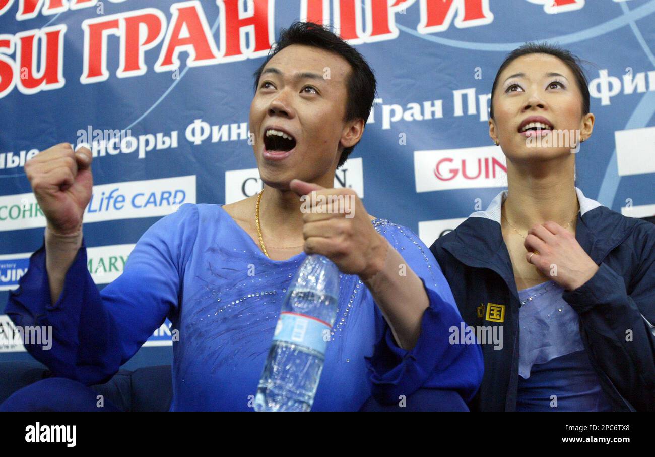 China's Xue Shen and Hongbo Zhao reacts as they watch the results after ...