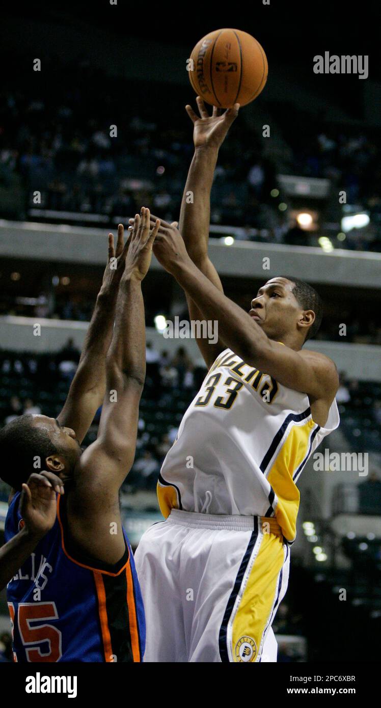 Indiana Pacers forward Danny Granger, right, shoots over New York ...