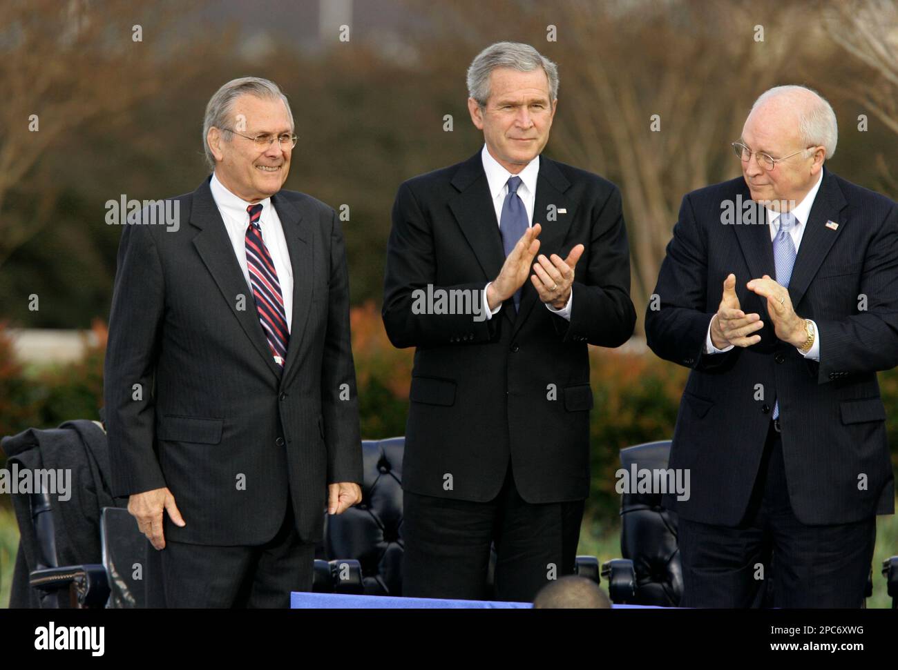 Secretary of Defense Donald Rumsfeld, left, smiles as President Bush ...