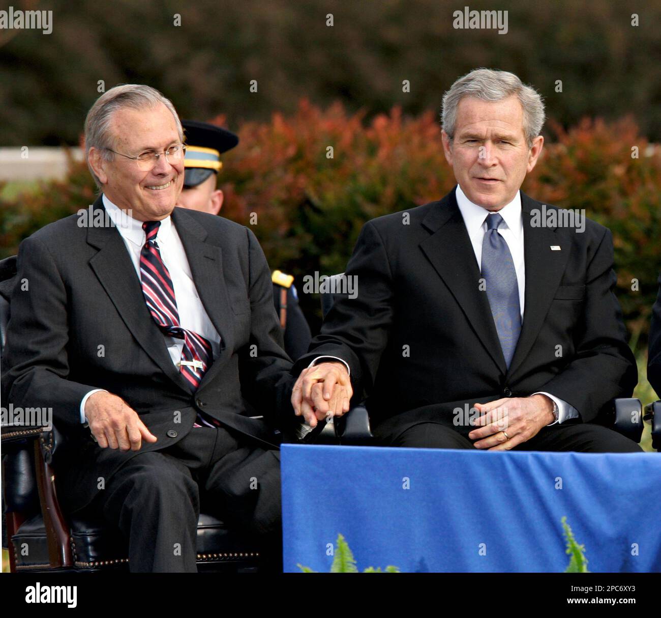 Secretary of Defense Donald Rumsfeld, left, smiles as President Bush ...