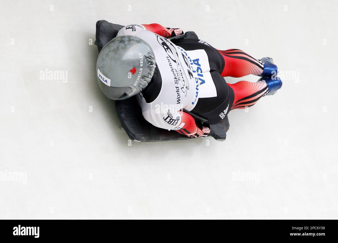Michelle Kelly, of Canada, slides through curve 19 at the Olympic ...