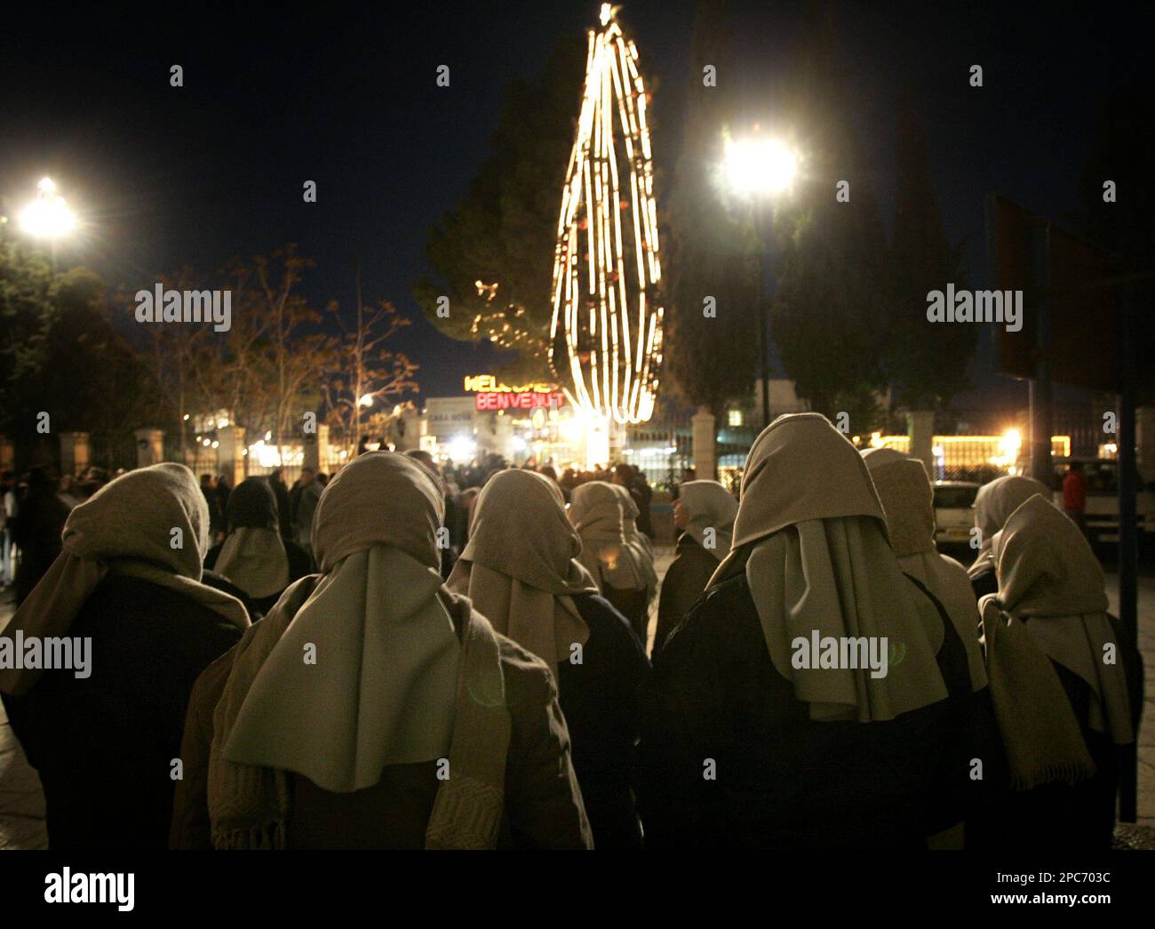 Catholic nuns look at Christmas decorations in Manger Square, where the ...