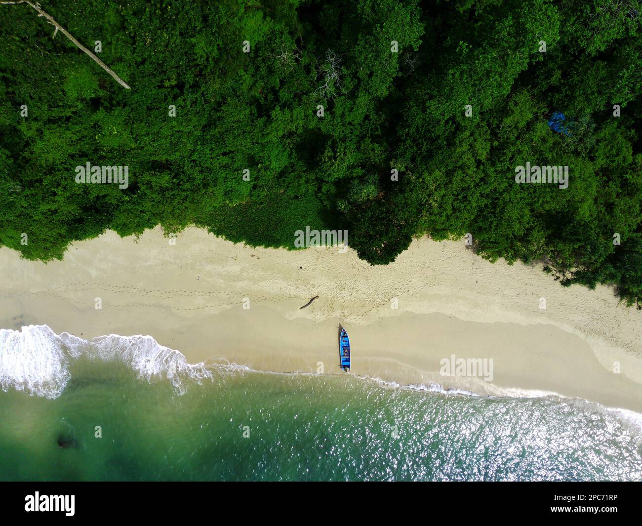 Aerial photo of a Traditional boat moored on the beach in Teluk Ijo ...