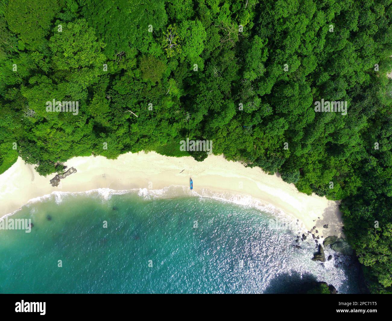 Aerial photo of a Traditional boat moored on the beach in Teluk Ijo ...