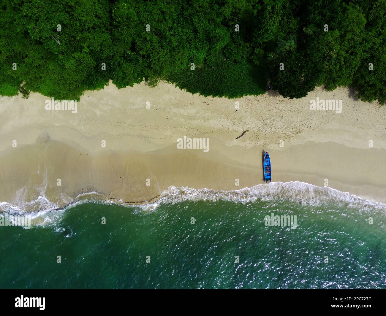 Aerial photo of a Traditional boat moored on the beach in Teluk Ijo ...
