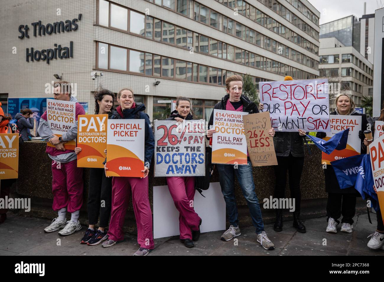 London, UK. 13th Mar, 2023. Junior doctors are seen holding placards at ...