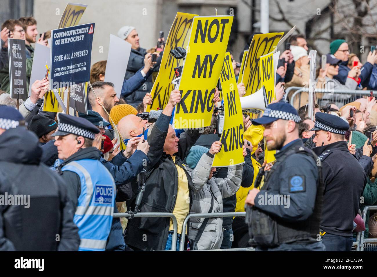 London, UK. 13th Mar, 2023. A group hold up placards saying - Not my ...