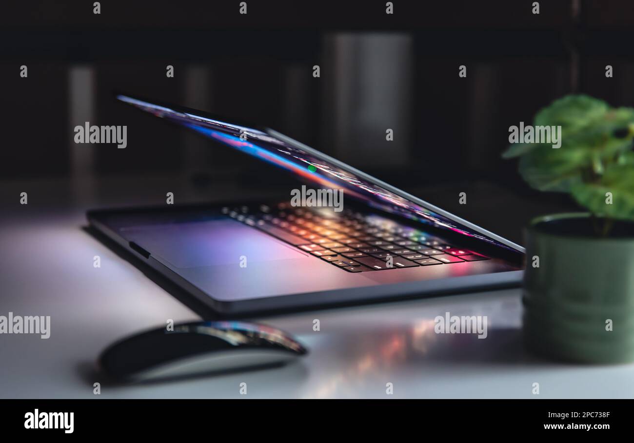 Close up of laptop keyboard colorful neon illumination, backlit ...