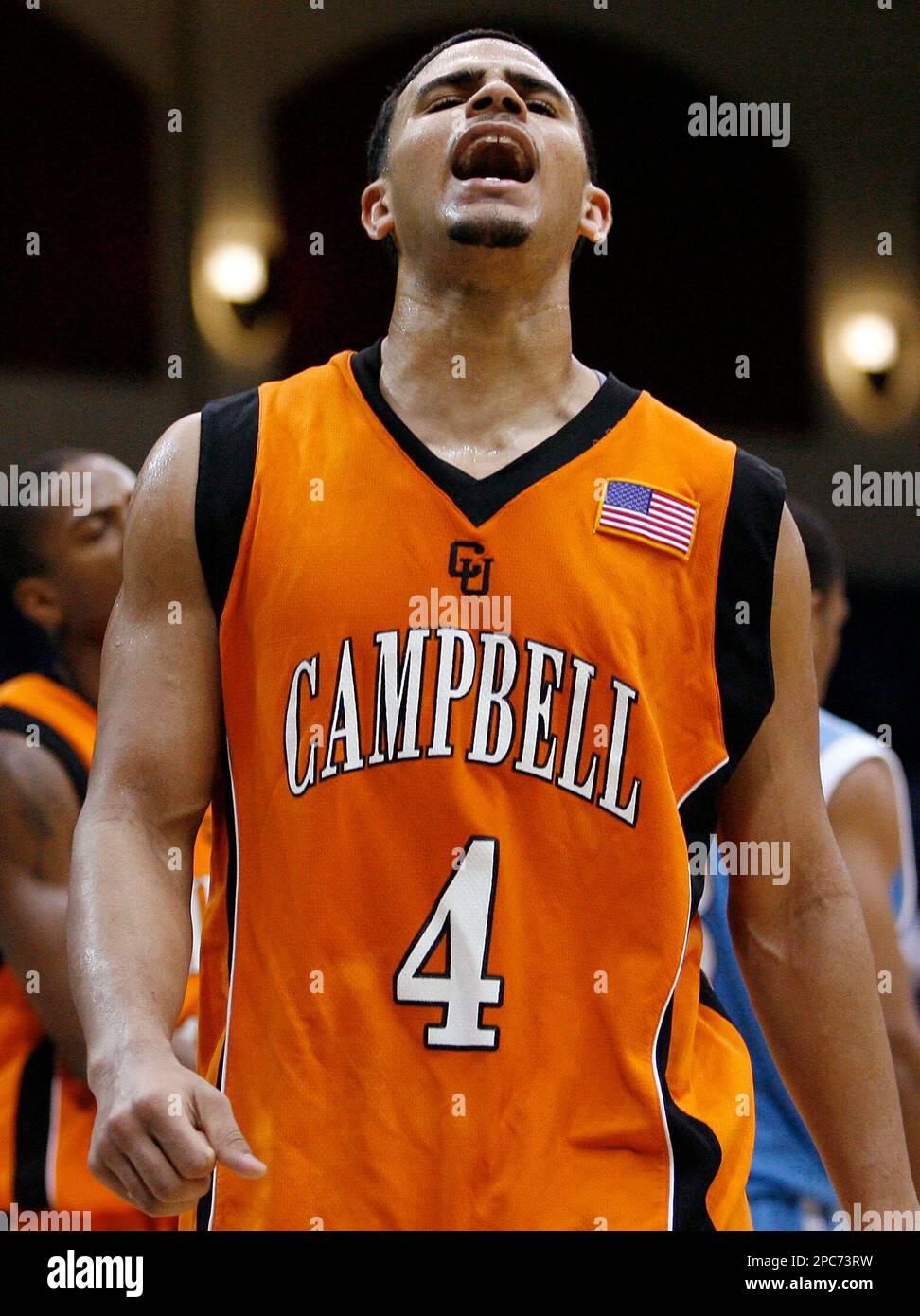 Campbell's Reggie Bishop yells after fouling San Diego's Theo White ...