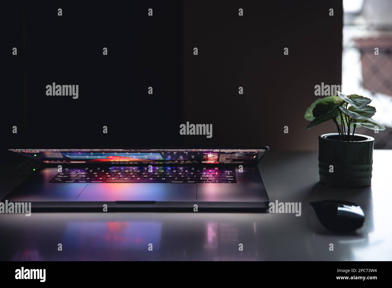 Close up of laptop keyboard colorful neon illumination, backlit ...