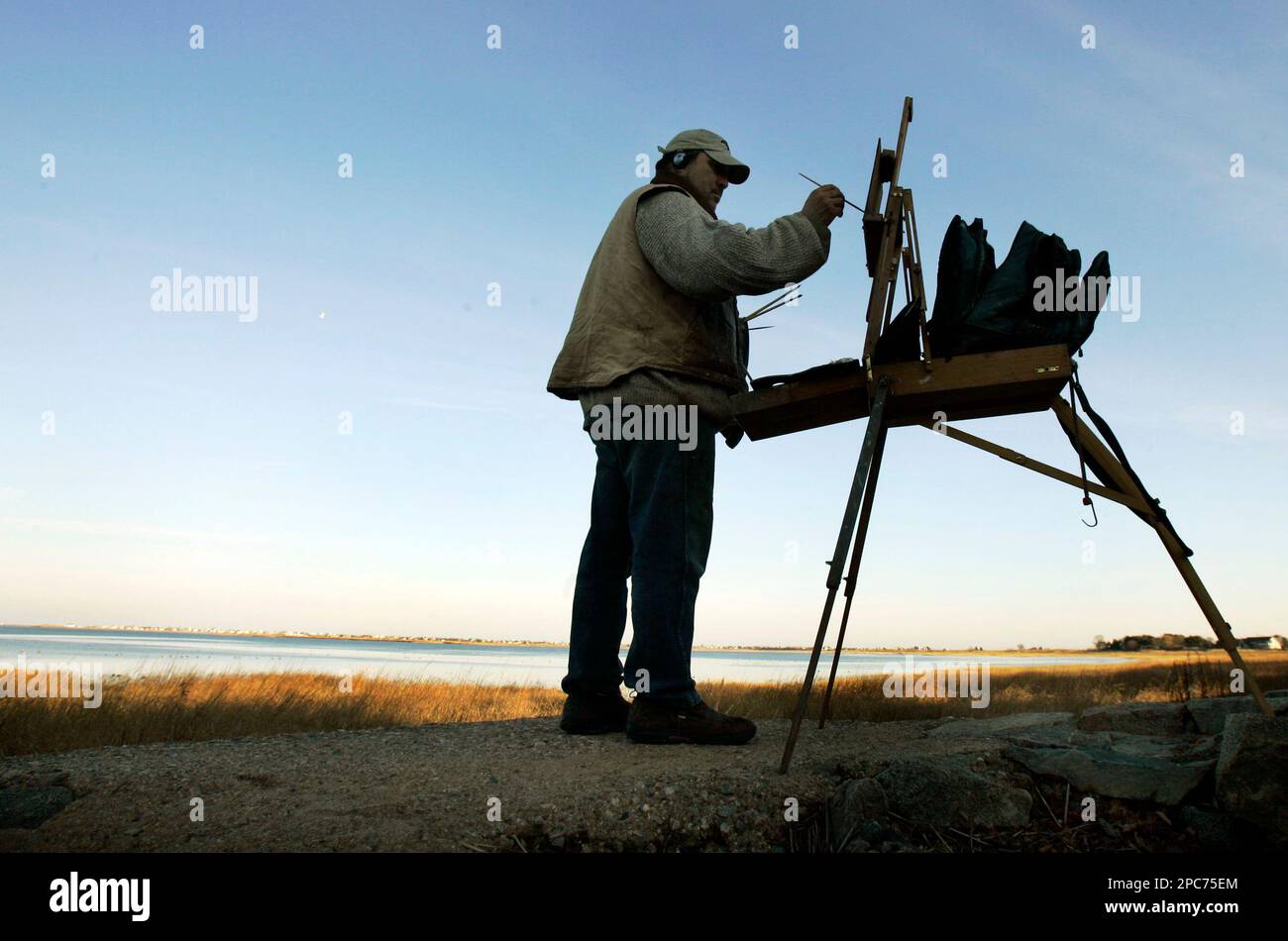 Artist Stephen LaPierre of Haverhill, Mass. takes advantage of a mild ...