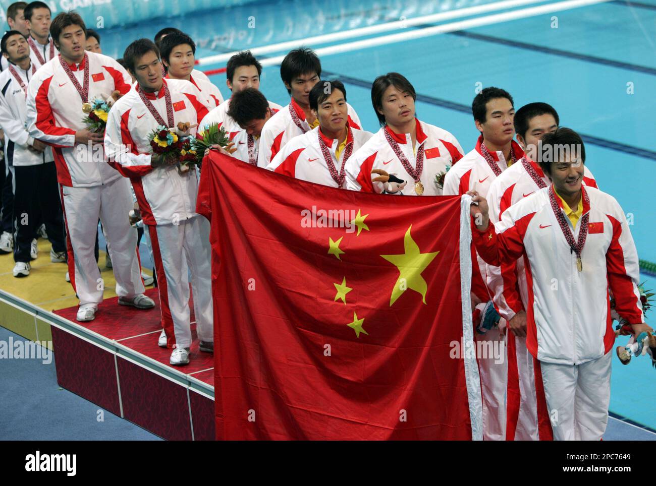 Chininese water polo team celebrates their gold medal victory with a ...
