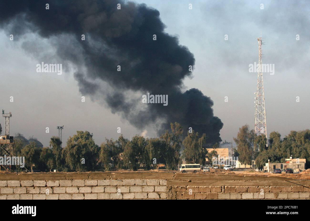 Smoke is seen coming out of al Dora refinery in southern Baghdad, Iraq ...