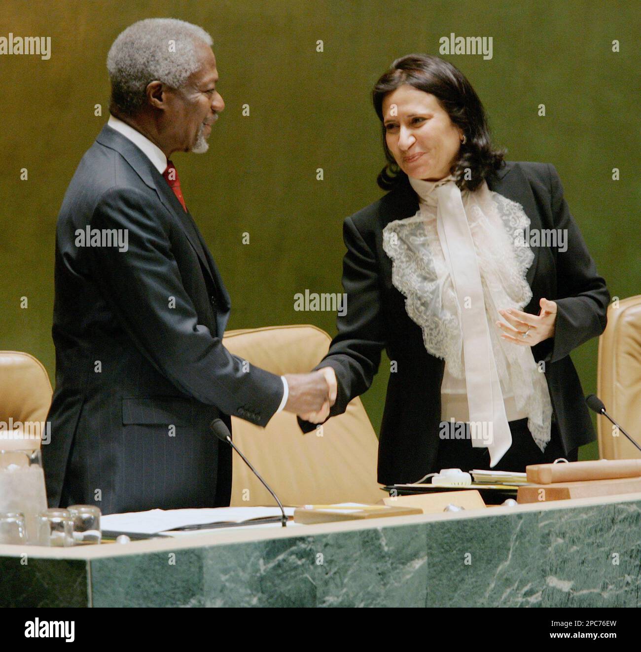 United Nations Secretary-General Kofi Annan shakes hands with Sheikha ...