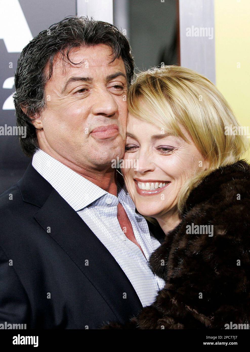 Sylvester Stallone, star of the film "Rocky Balboa," gets a hug from ...