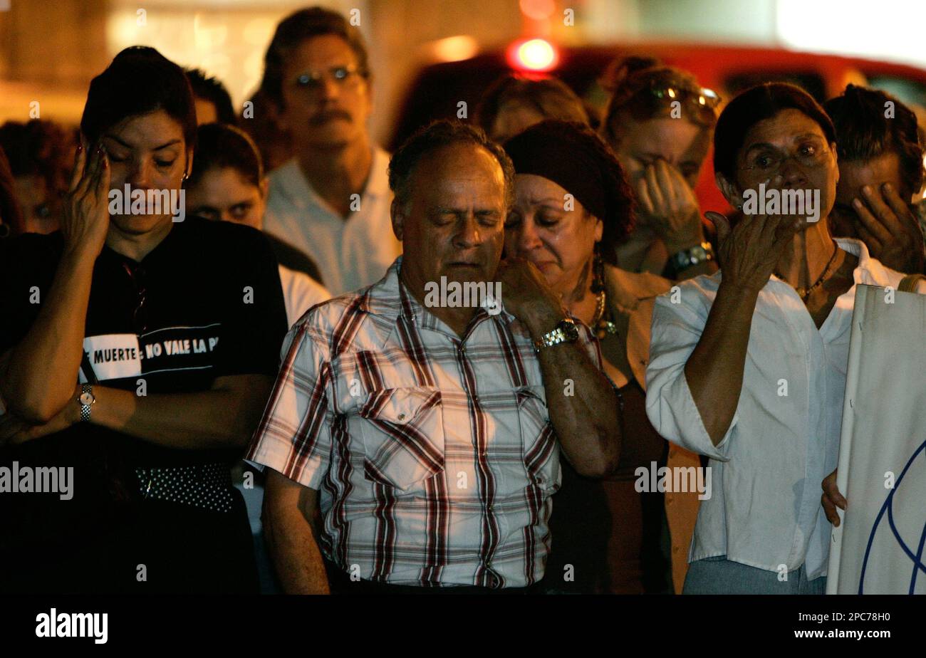 Death penalty opponents cry during a vigil in colonial Old San Juan ...