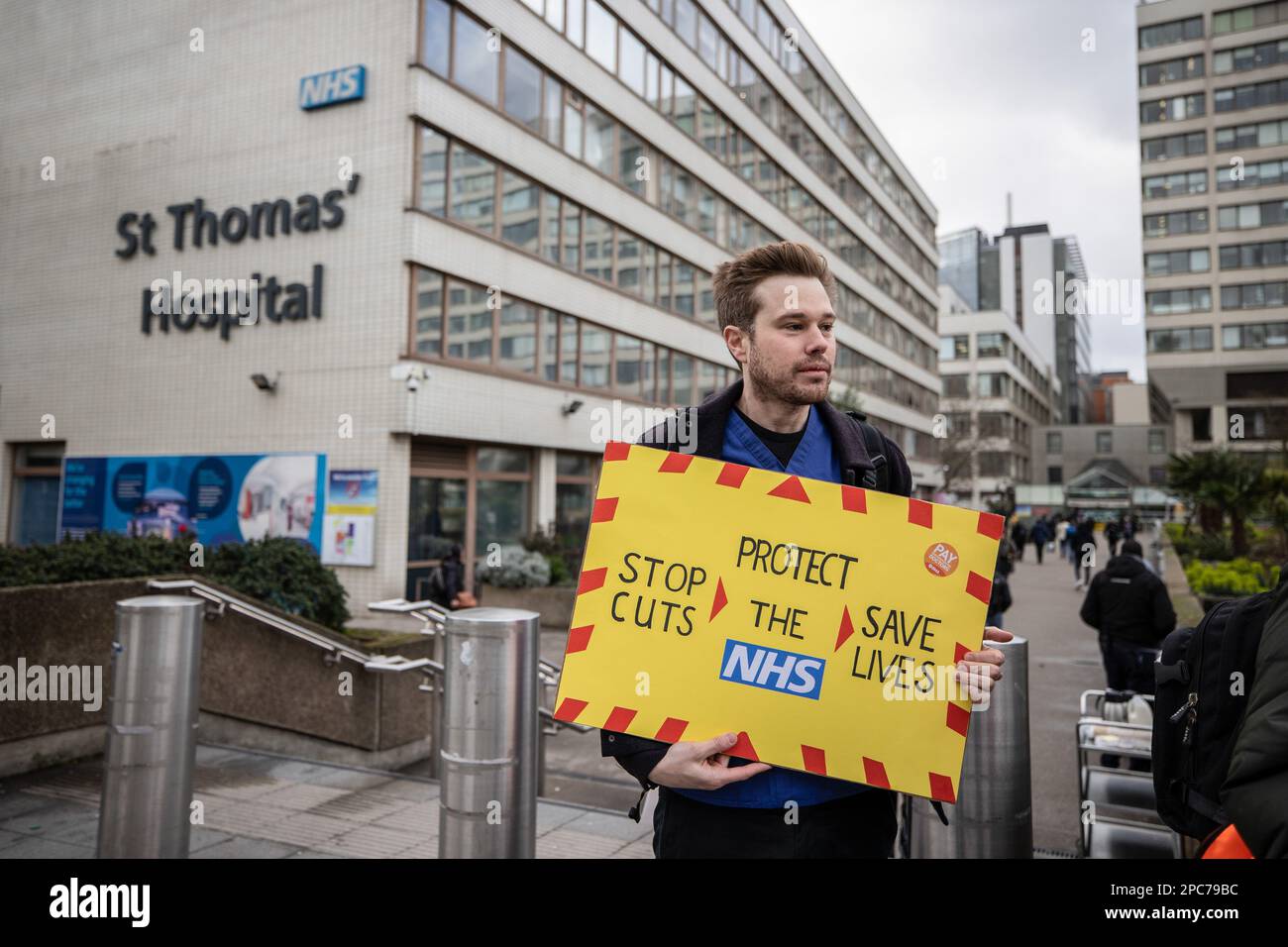 London, UK. 13th Mar, 2023. Junior doctors are seen holding placards at the picket line at St ...