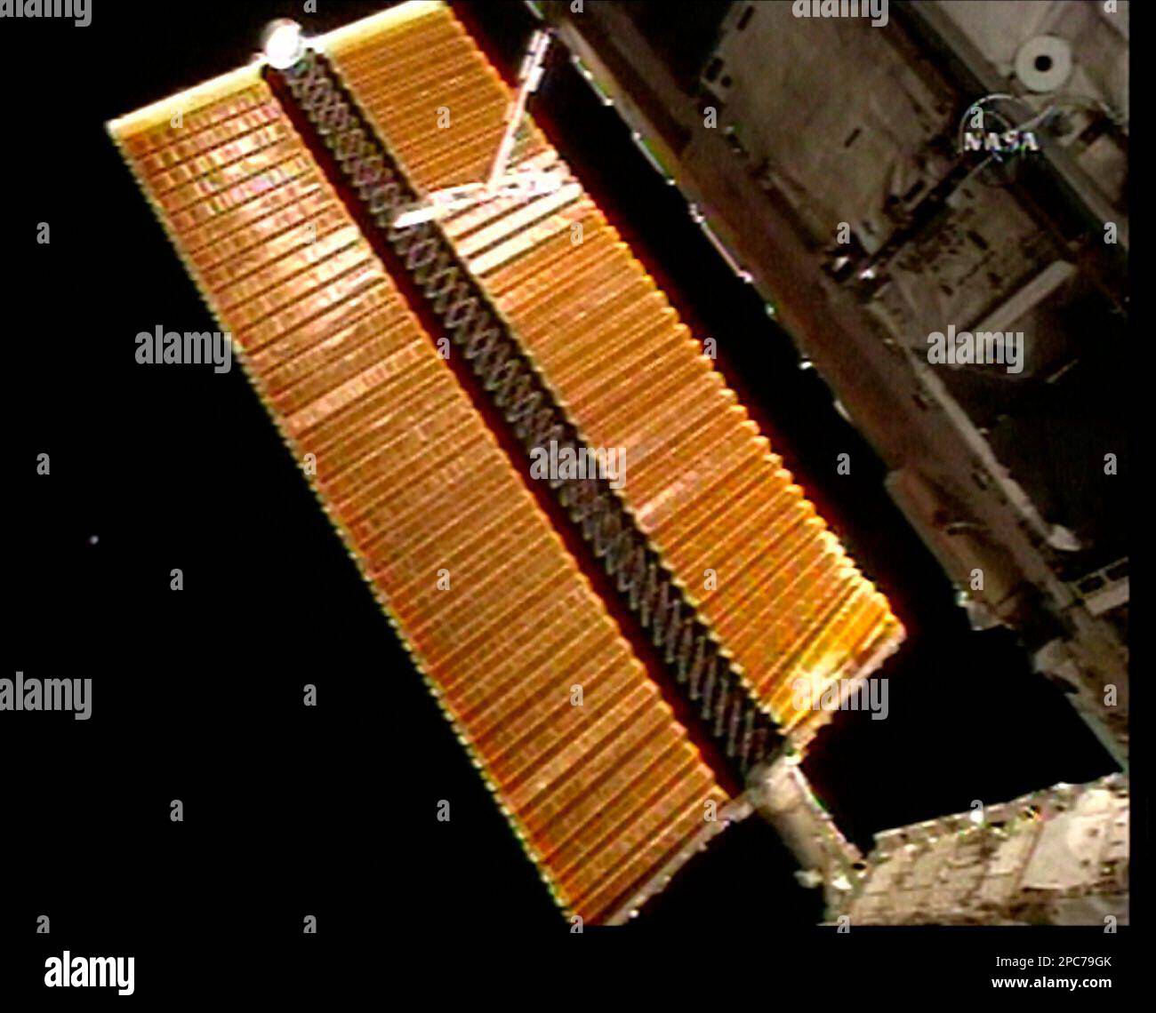 In this image from NASA Television, a view of the solar array panel ...